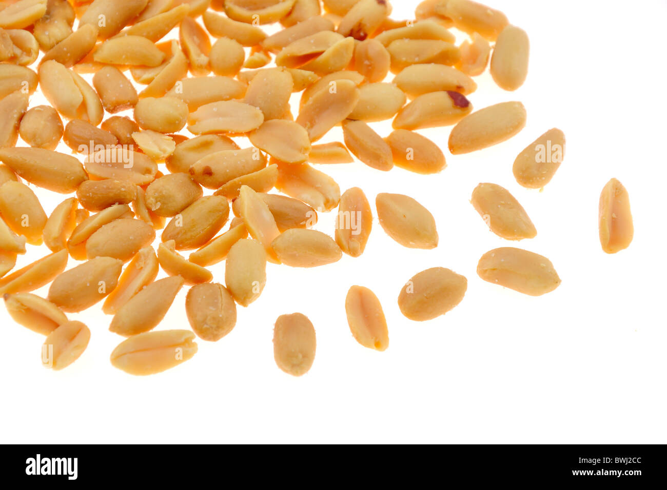 Peeled double fried and salted peanuts on white background Stock Photo ...