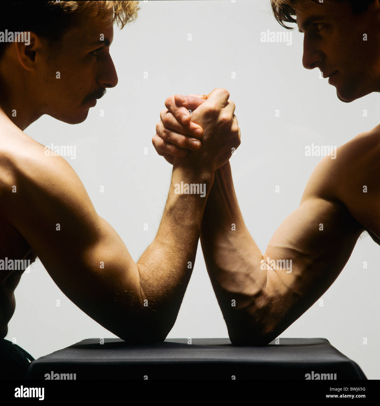 TWO MEN ARM WRESTLING Stock Photo - Alamy