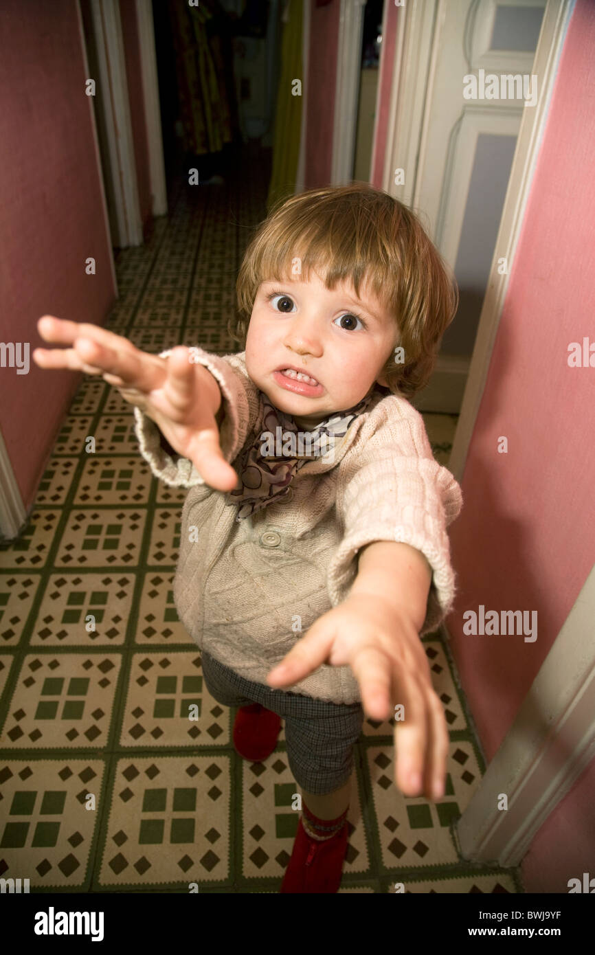 23 month boy reaching out to grab his father's camera! Stock Photo - Alamy