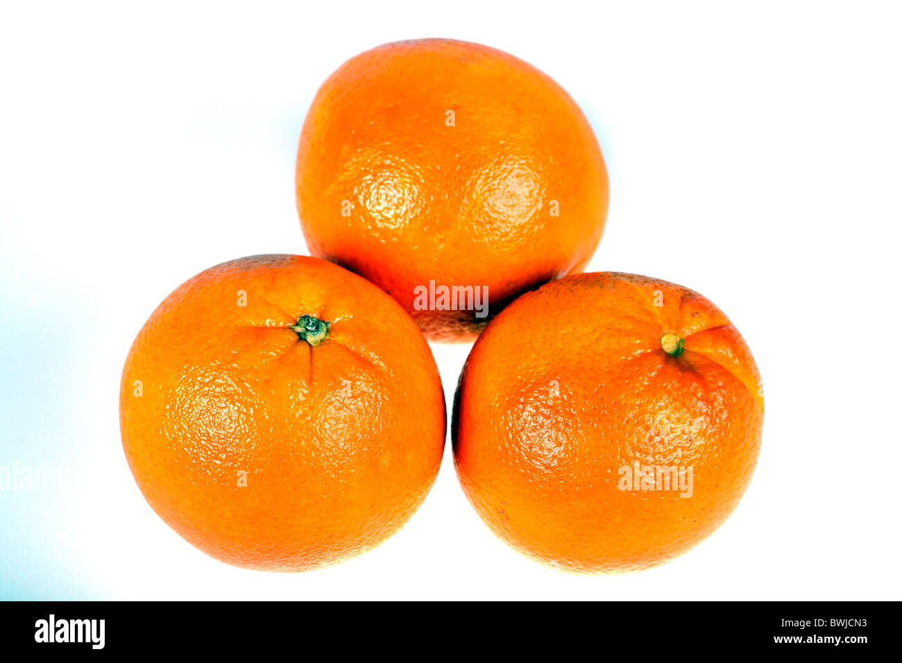 three juice oranges isolated on white background Stock Photo - Alamy