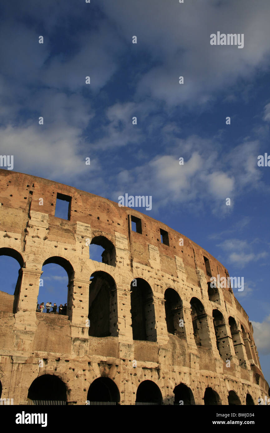 people in the colosseum amphitheatre wall facade, rome Stock Photo - Alamy