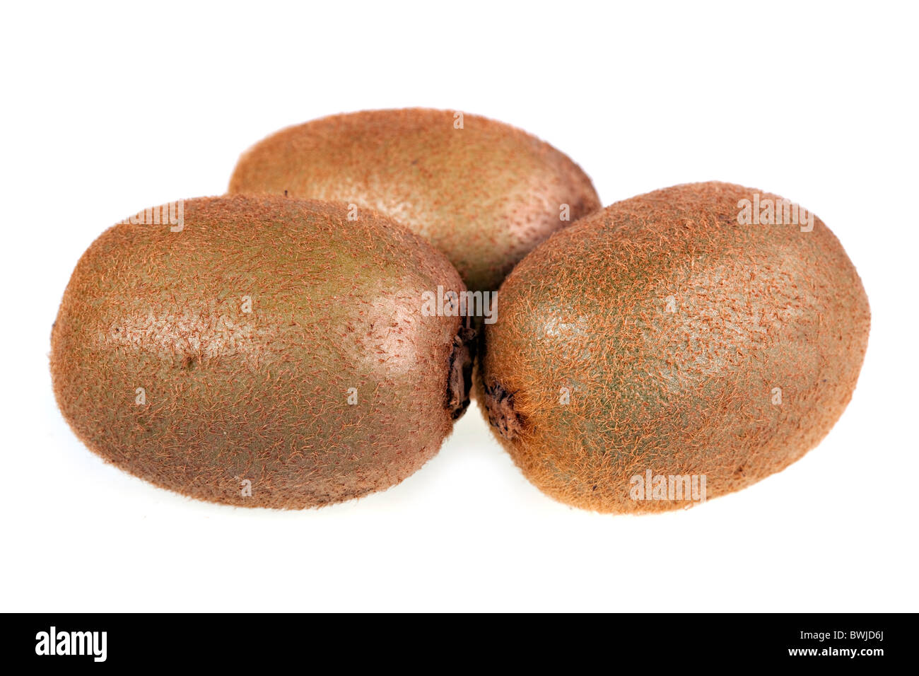 Three ripe kiwi. Isolated over white Stock Photo - Alamy