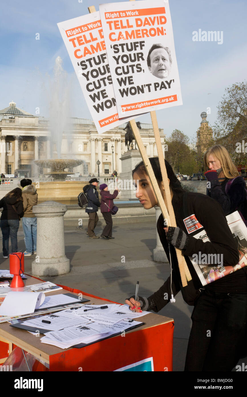 Young female student signs petition during protest against government ...