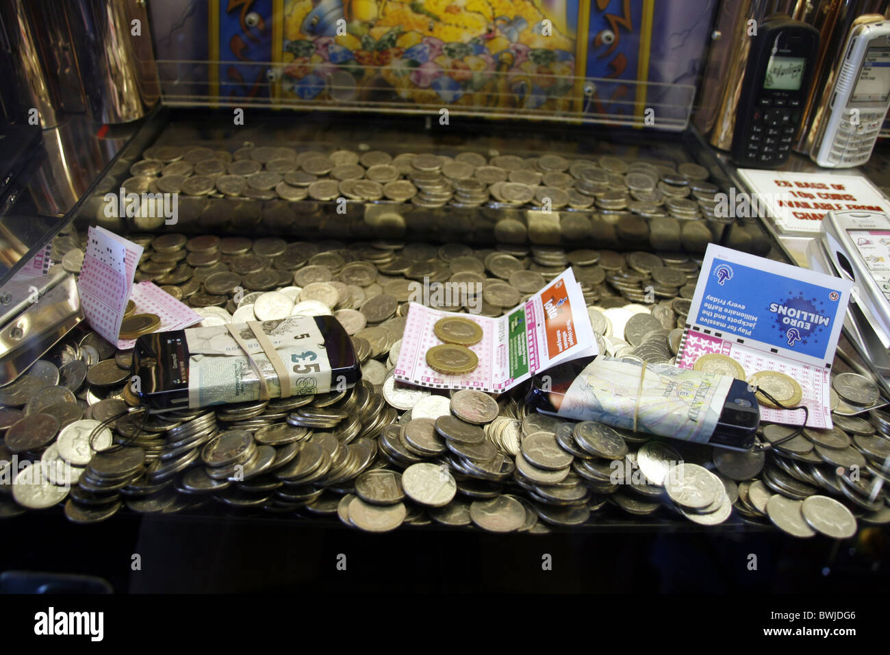 gambling machine game with coins and prizes in casino amusement arcade ...