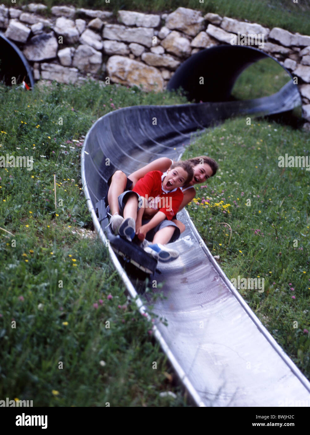 summer toboggan run toboggan run mother child family chat fun joke ...