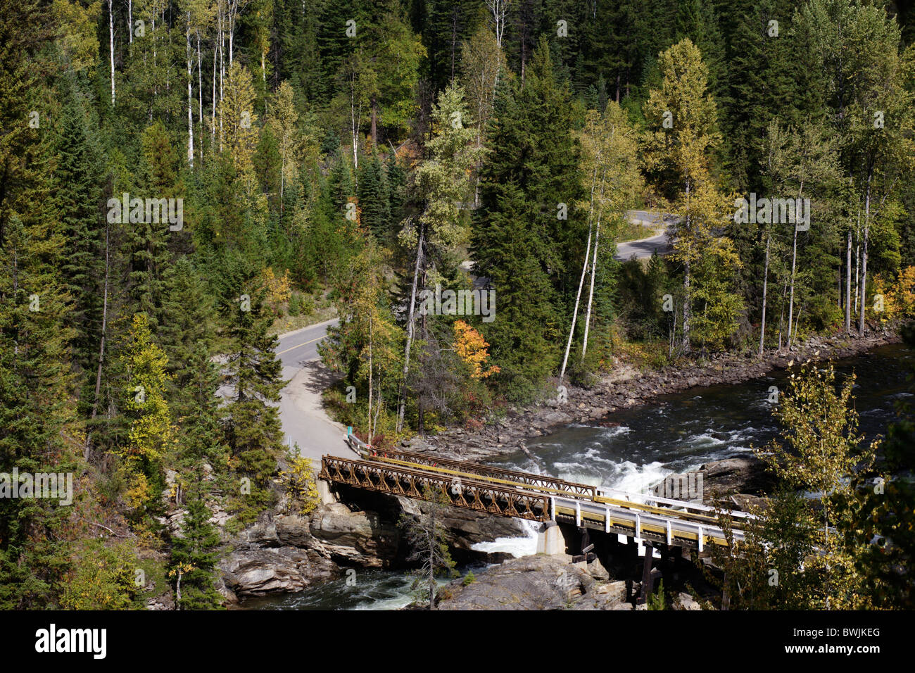 A road bridge over a river in the forest the Canadian Rocky Mountains ...