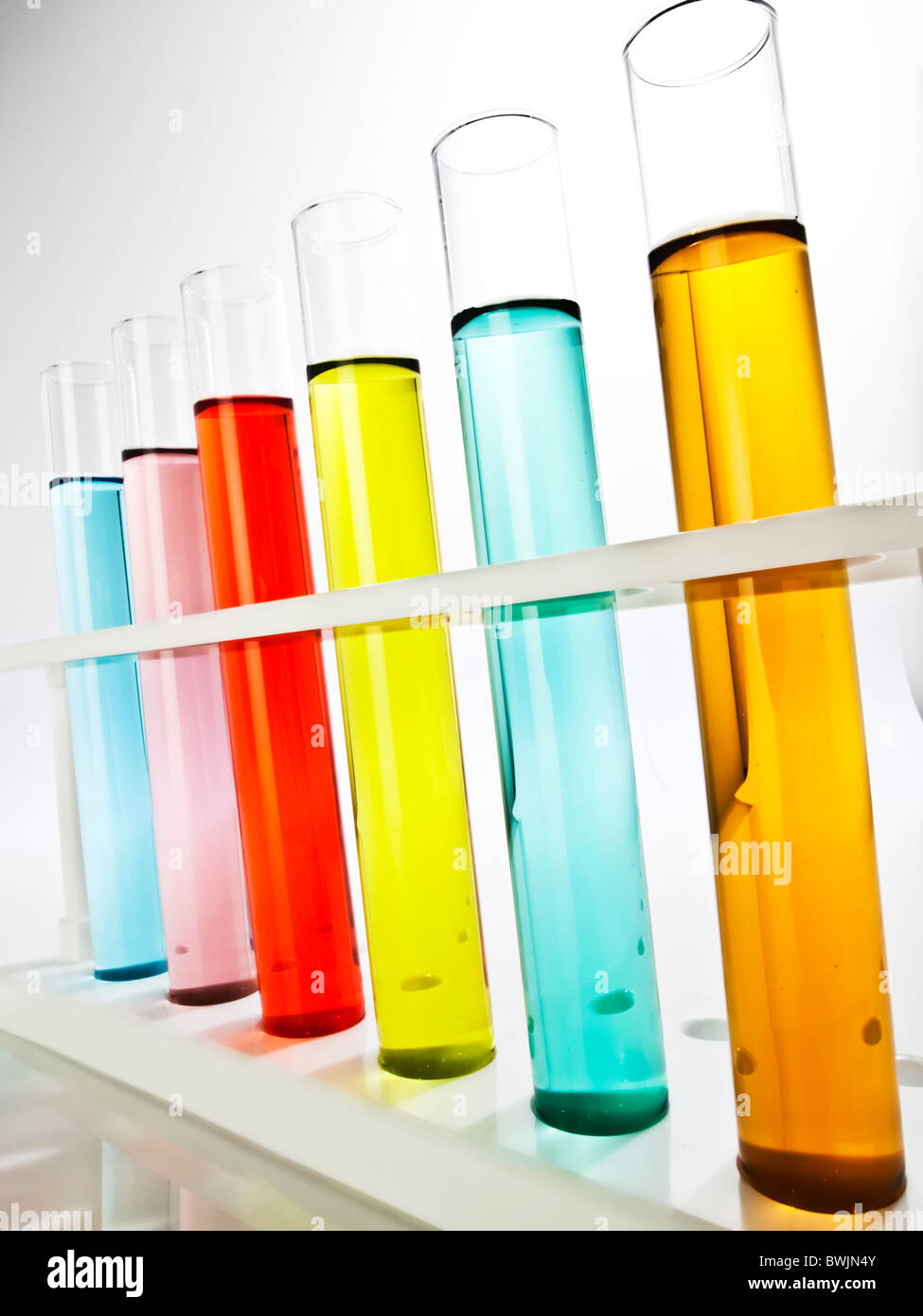 Row of test tubes filled with colored fluid Stock Photo - Alamy