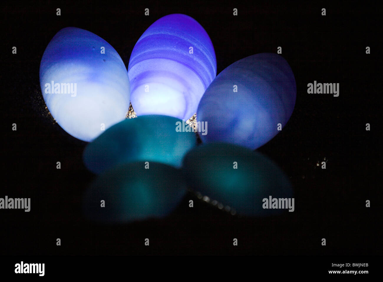 Lighted blue zen stones Stock Photo - Alamy