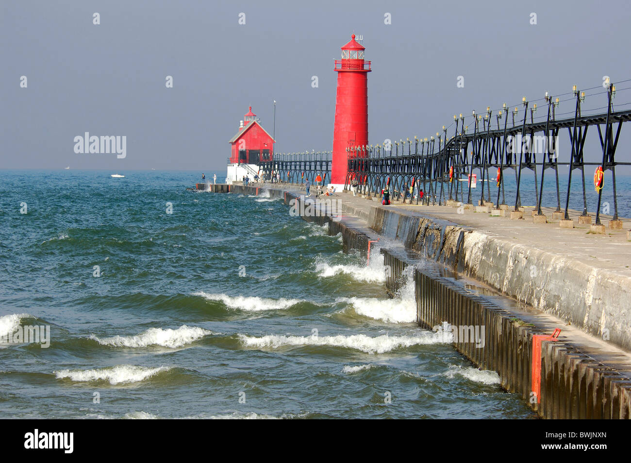 lighthouse mole jetty pier jett lake shore shore person surf Lake ...