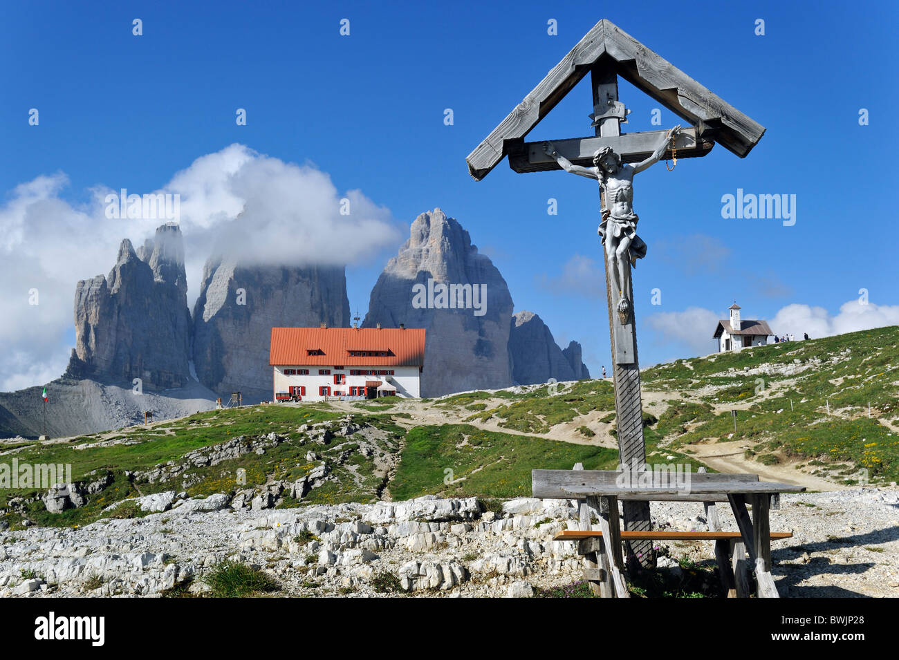 Crucifix and the Rifugio Antonio Locatelli in front of the Tre Cime di ...