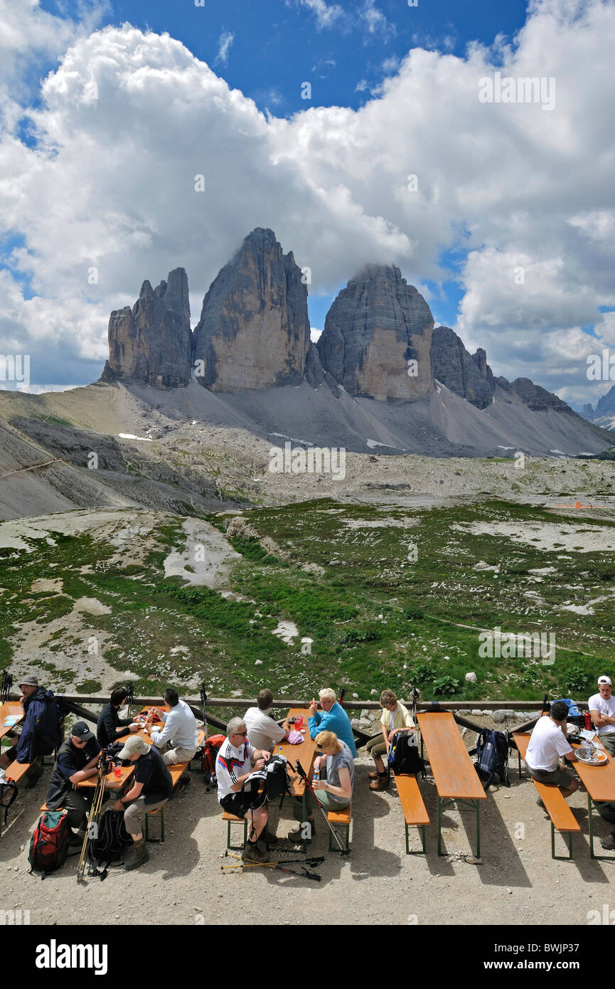 Tourists on terrace of the Dreizinnenhütte / Rifugio Antonio Locatelli ...