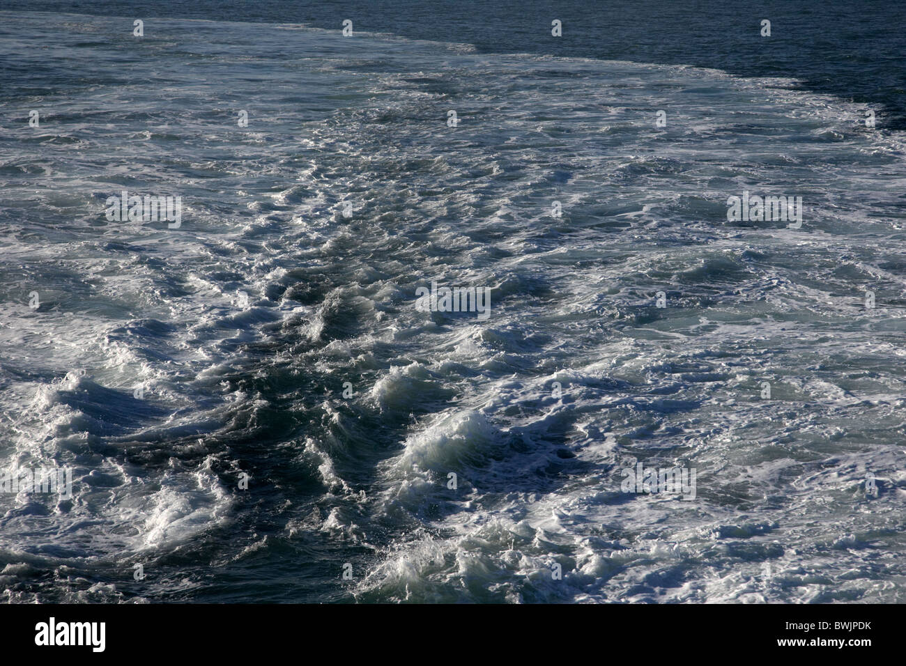 wake of catamaran fast ferry in the irish sea Stock Photo - Alamy