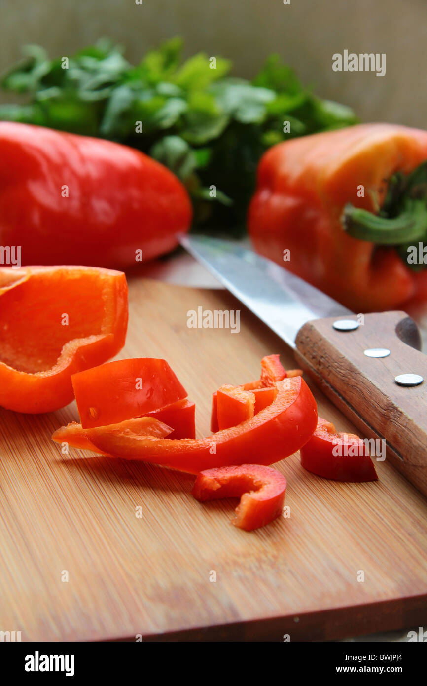 red pepper sliced and purified on a wooden board Stock Photo - Alamy