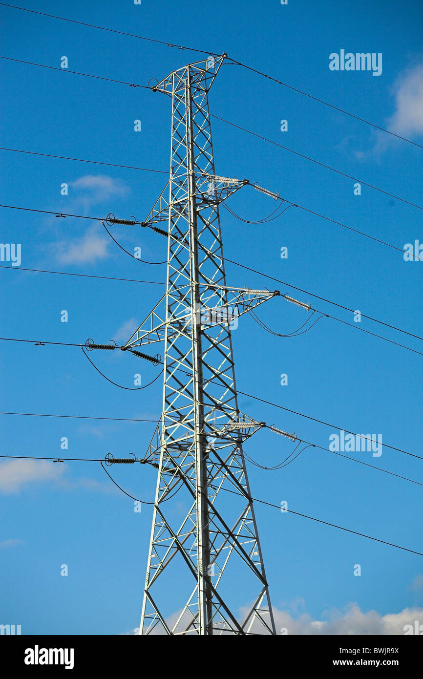 Electricity pylon against a blue sky Stock Photo - Alamy