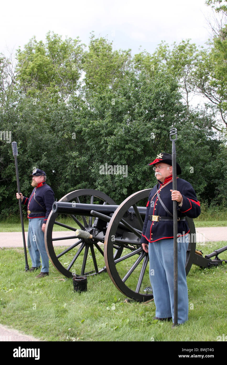 A Civil War soldier reenactor period standing guard by the cannon Stock ...