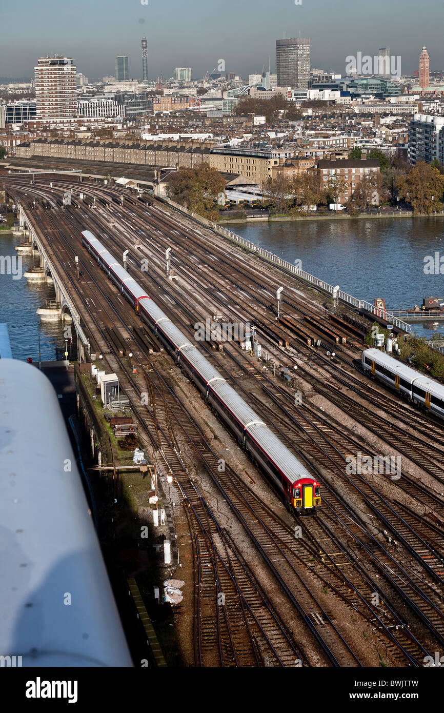 Gatwick Express traveling along the tracks by Battersea Power Station ...