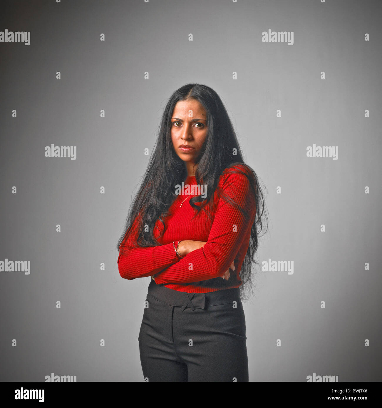 Young Hispanic woman female casual clothes, jeans, body language, arms ...