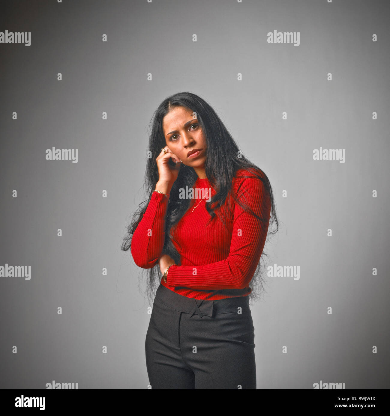 Young Hispanic woman female casual clothes, jeans, body language, arms ...