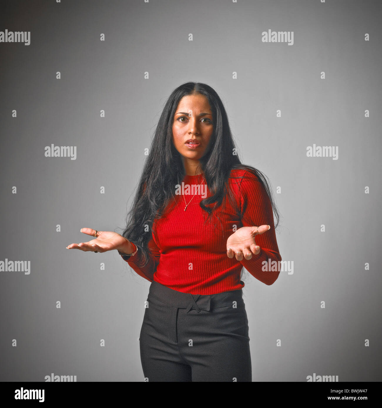 Young Hispanic woman female casual clothes, jeans, body language, arms ...