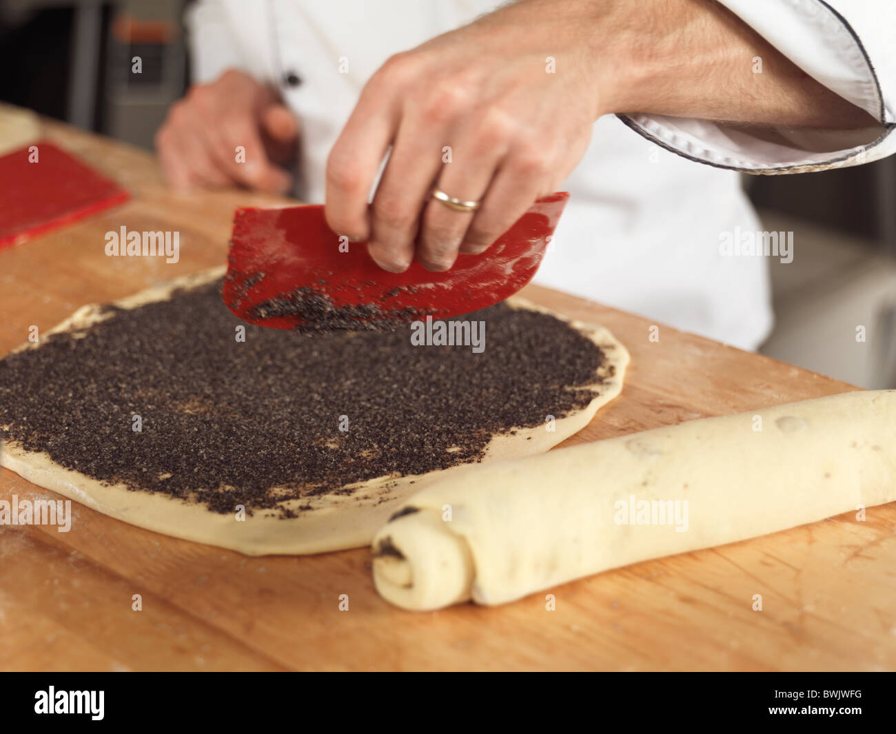 Person spreading filling rolling pastry hi-res stock photography and ...