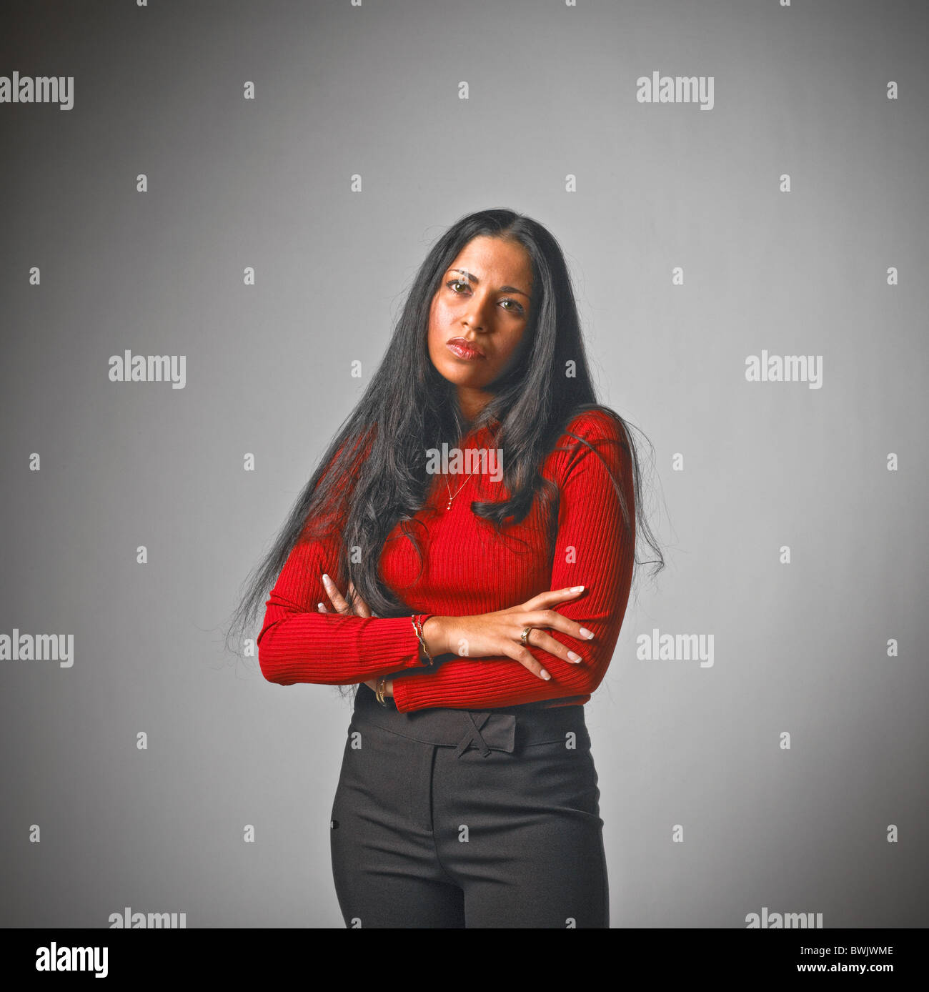 Young Hispanic woman female casual clothes, jeans, body language, arms ...