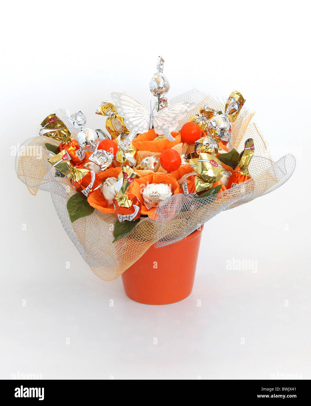 Sweets Arrangement Flower Arrangement made from candy on white Stock ...