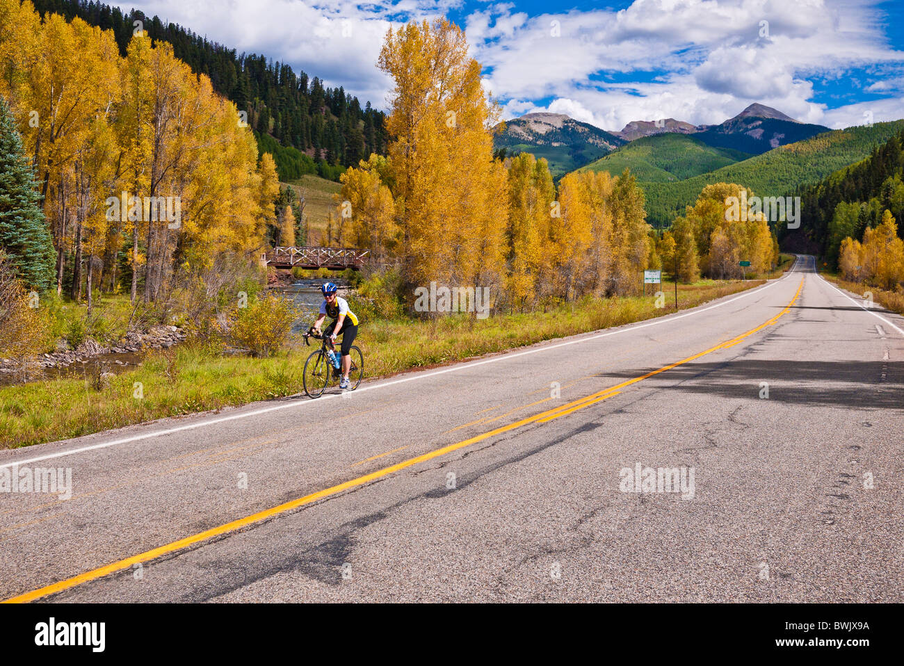 Cyclist on the San Juan Skyway (Highway 145), San Juan National Forest ...