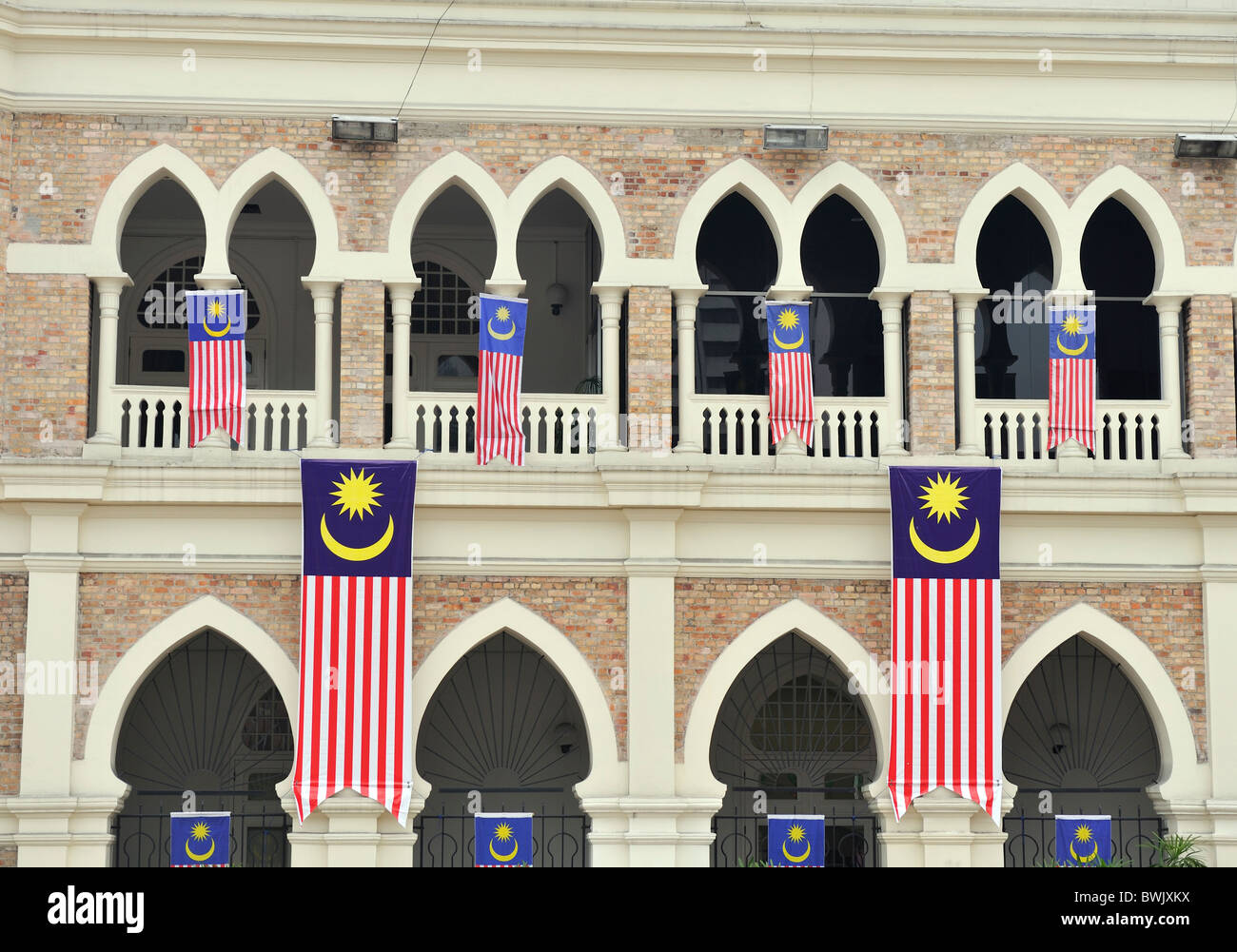 Malaysian flags cover the colonial buildings in Central Padang, Kulala ...