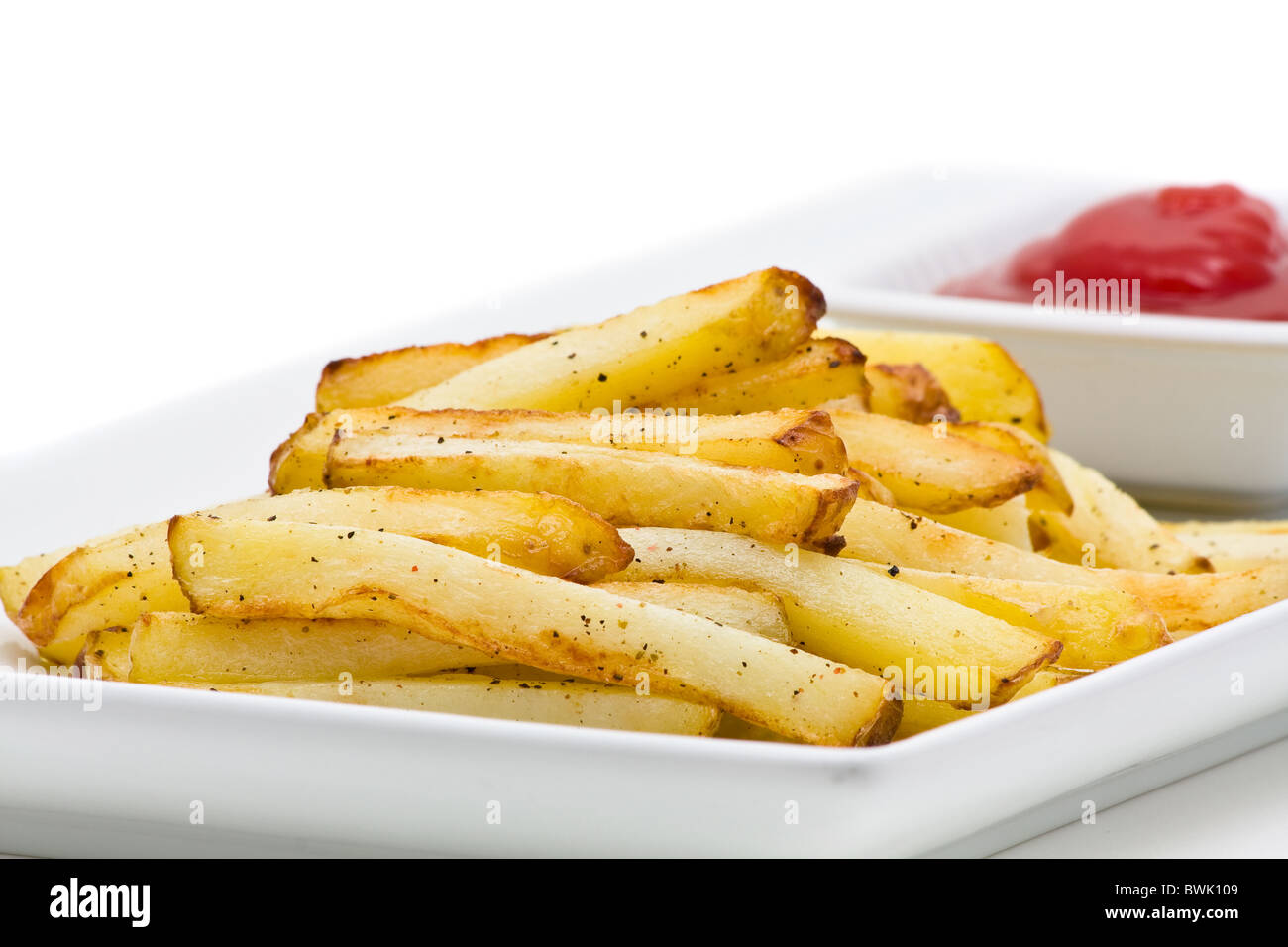 Delicious handmade french fries on plate over white background Stock ...