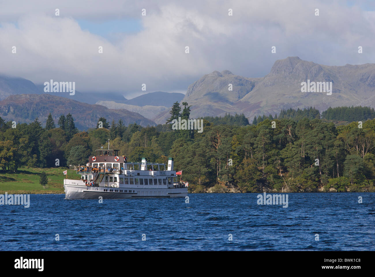 Steamer cruising on Lake Windermere, with Langdale Pikes behind, Lake District National Park ...
