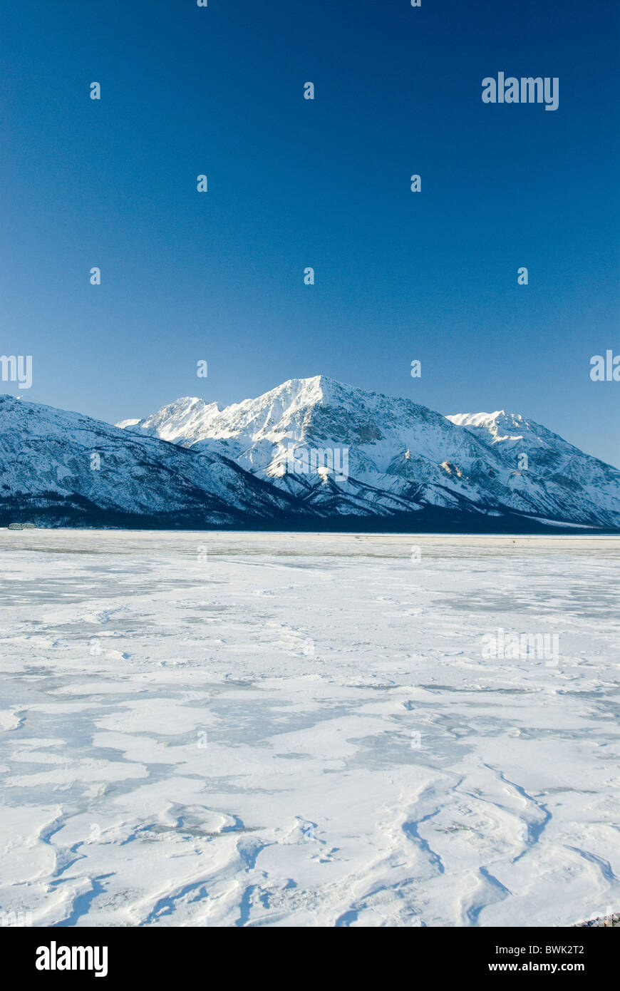 Kluane Lake frozen ice landscape mountains Yukon Canada North America ...