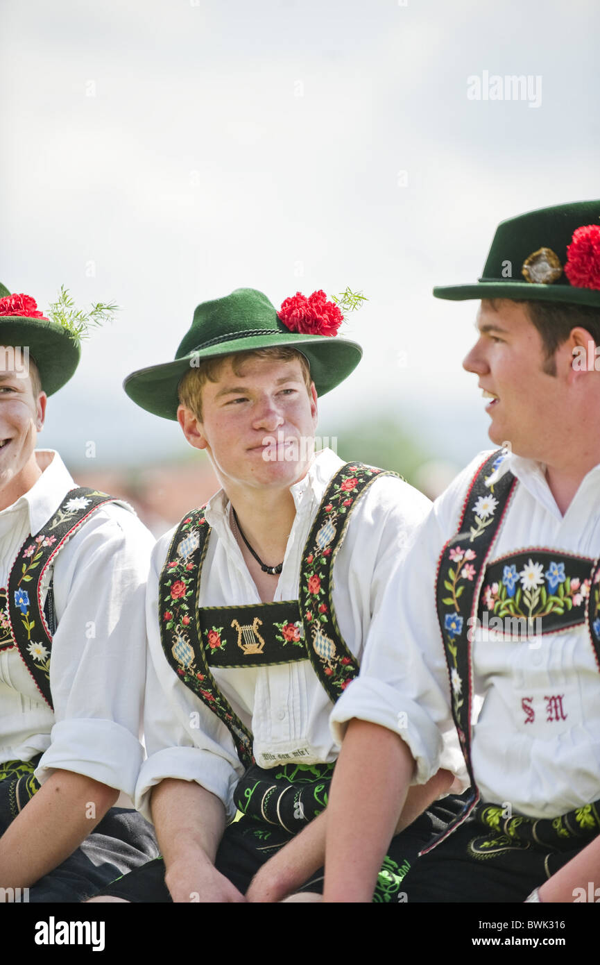 Three young men wearing traditional costumes, May Running, Antdorf ...