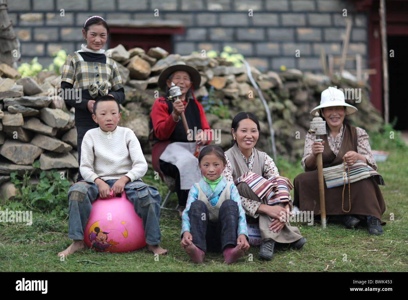 A traditional tibetan family pose for a photo in Litang, Sichuan ...