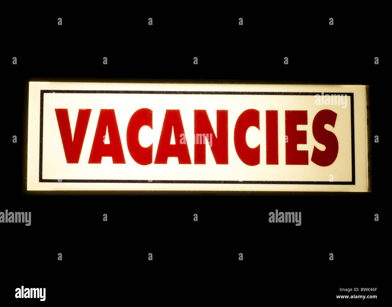 Vacancies neon sign isolated on black background Stock Photo - Alamy