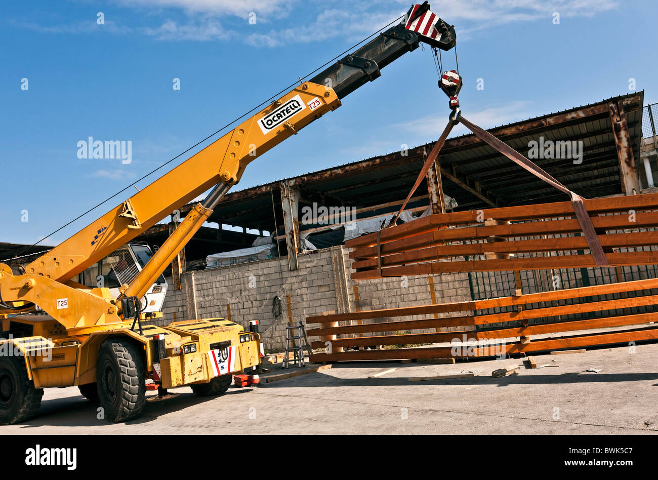 Truck Crane loading stock of glulam materials Stock Photo - Alamy