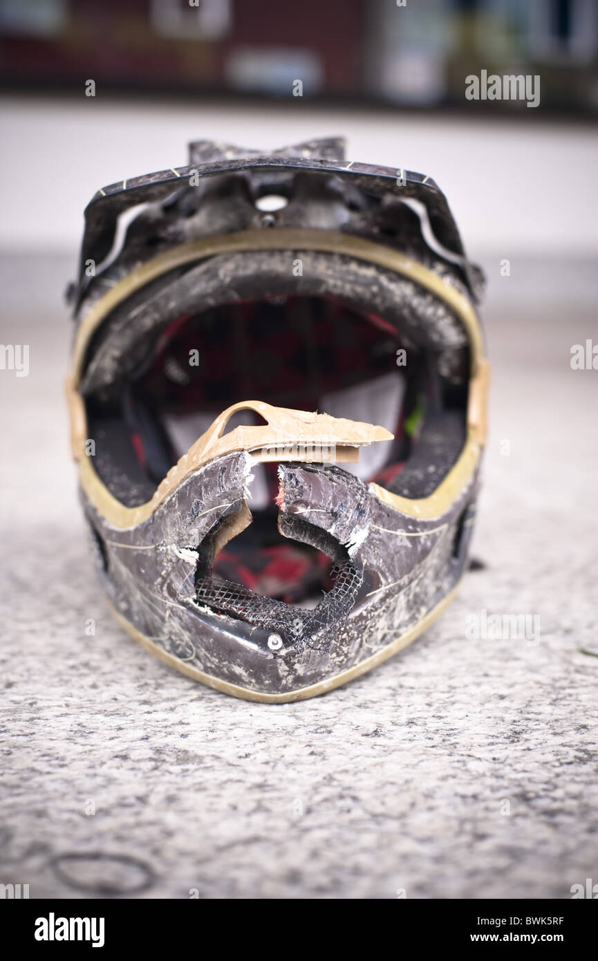 Damaged helmet of a mountainbiker after an accident Stock Photo - Alamy