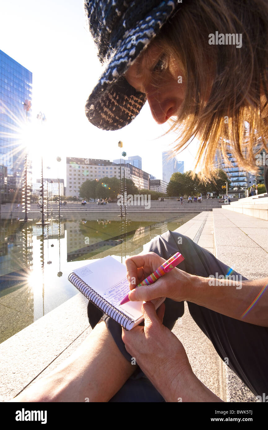Woman writing postcards hi-res stock photography and images - Alamy