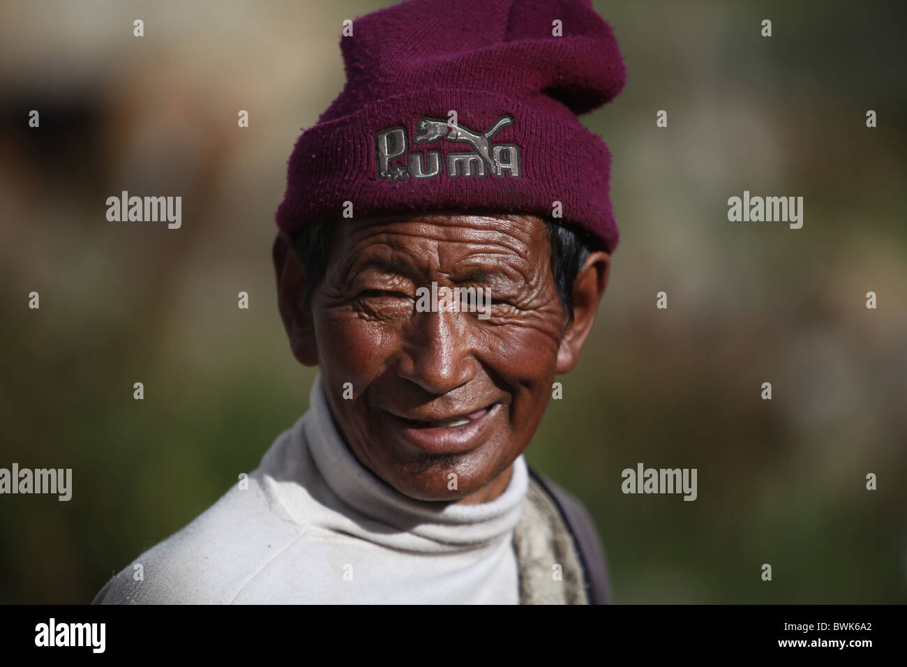 A smiling local man in Litang, Sichuan province, southwest China Stock ...