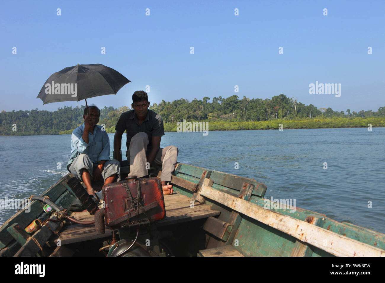 Local men in a boat on the way to Long Island, Baratang, Middle Andaman ...