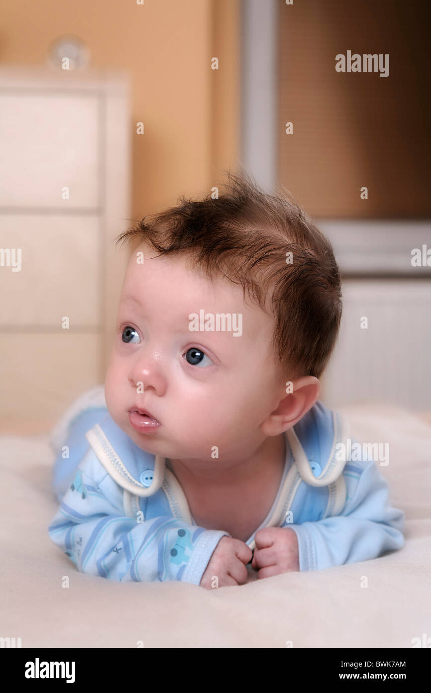 baby infant boy recumbent lie lying bed little bed portrait child Stock ...