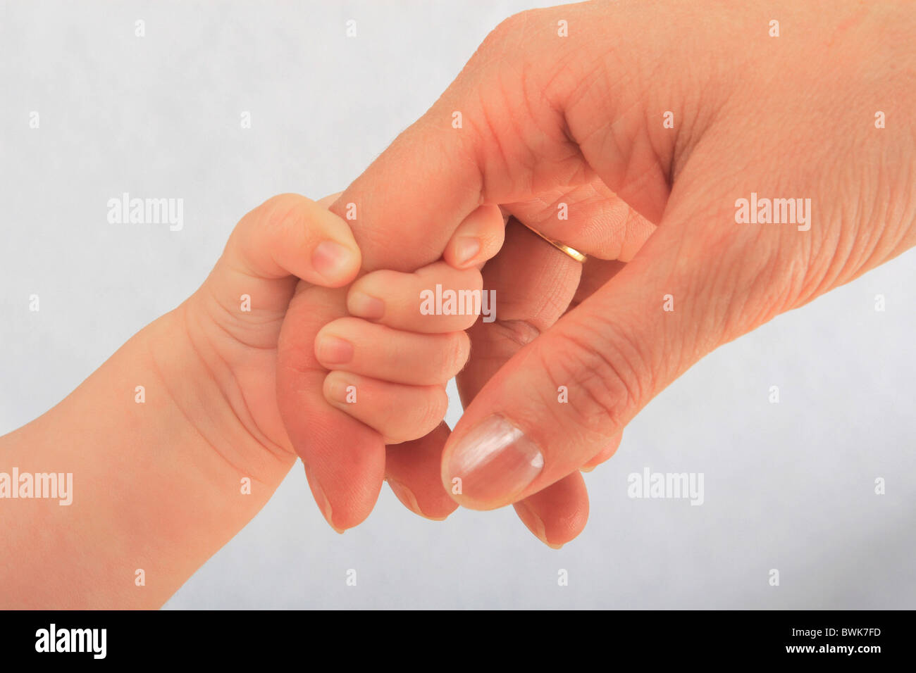 child baby infant baby hand mother hands little hands studio blue ...