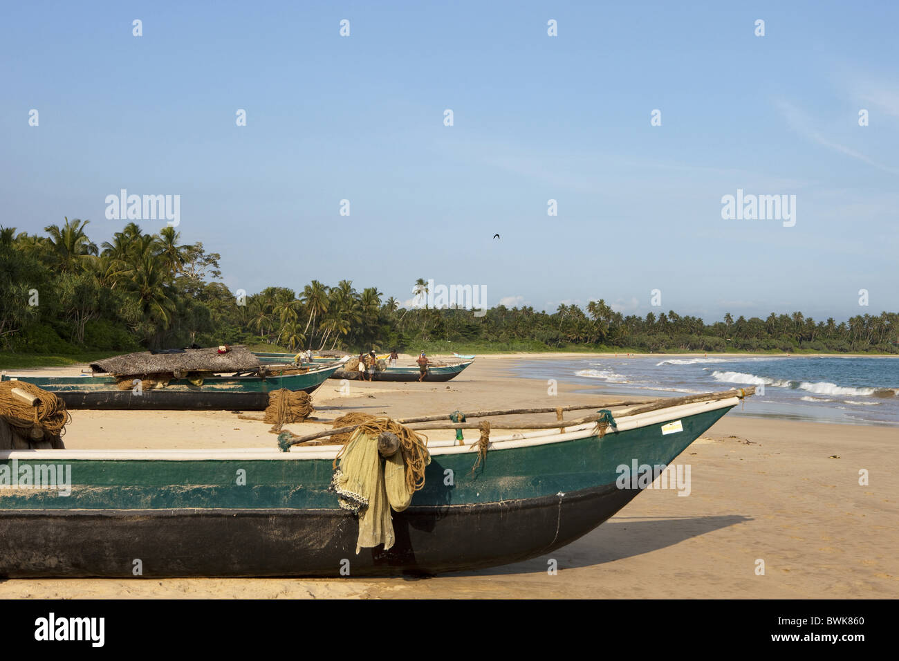 Fishermen and their boats at Talalla beach, Talalla, Matara, South ...