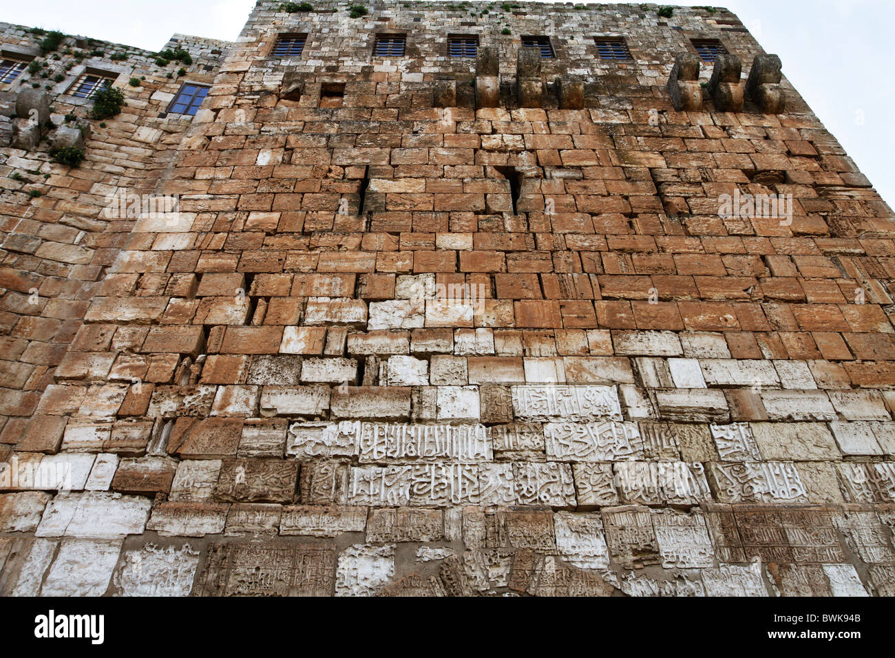 Arabic caligraphy carved on stone wall inside Krac Du Chevalier castle ...