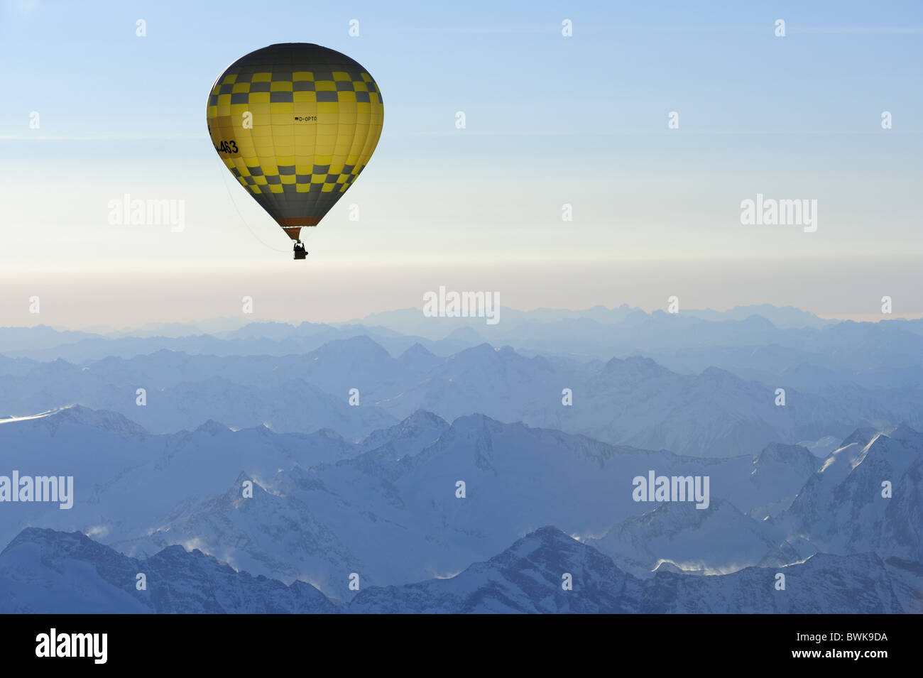 Hot-air balloon above snow-covered mountains, aerial photo, South Tyrol ...