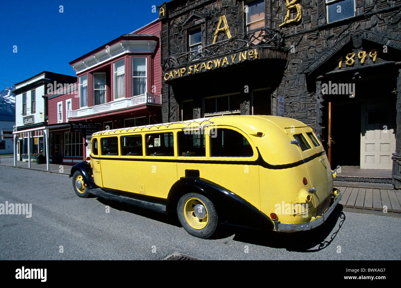 USA America North America Alaska Skagway Street Car yellow bus old ...