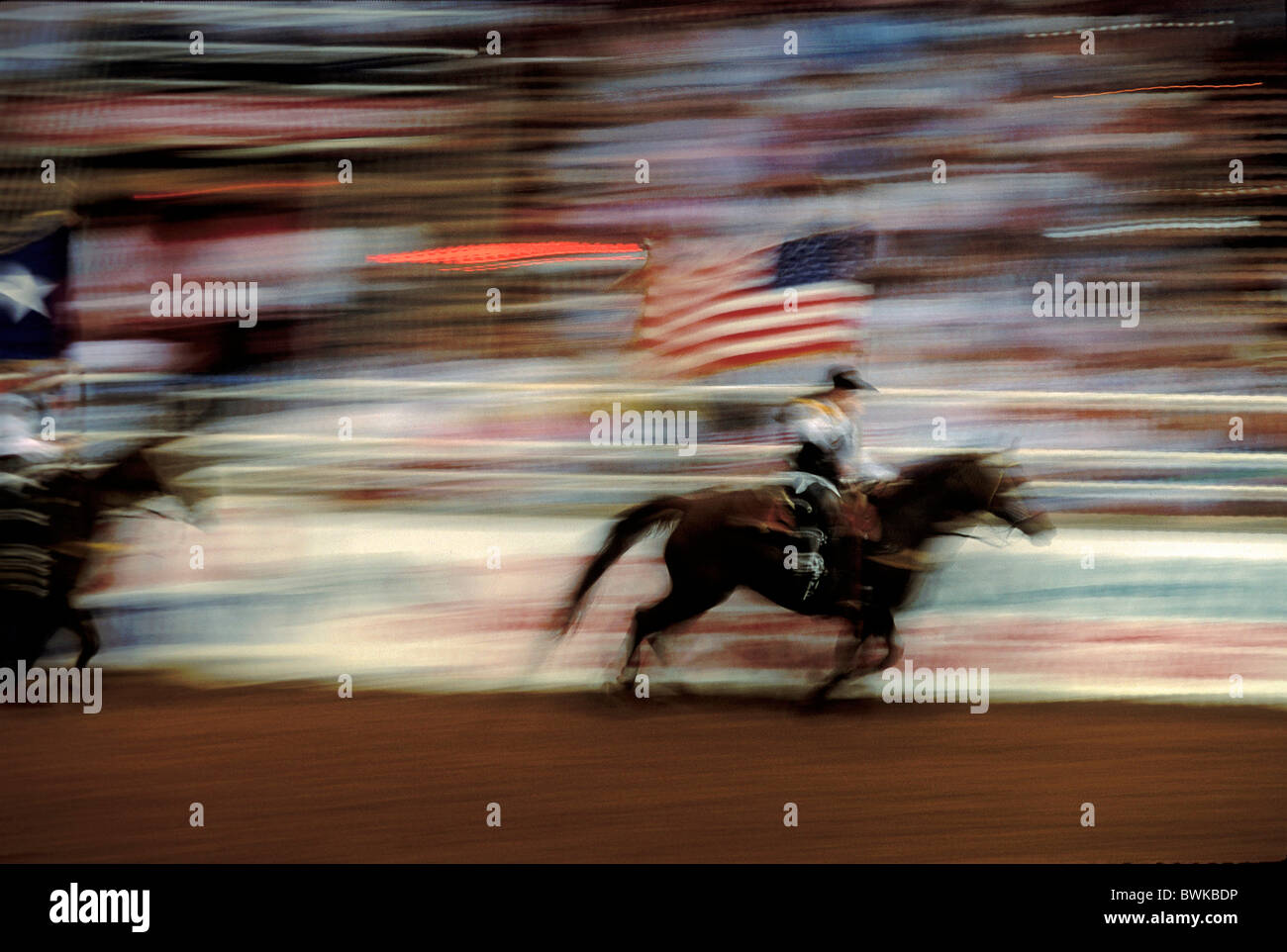 USA America North America rodeo rider Riding action blurs flag flag ...