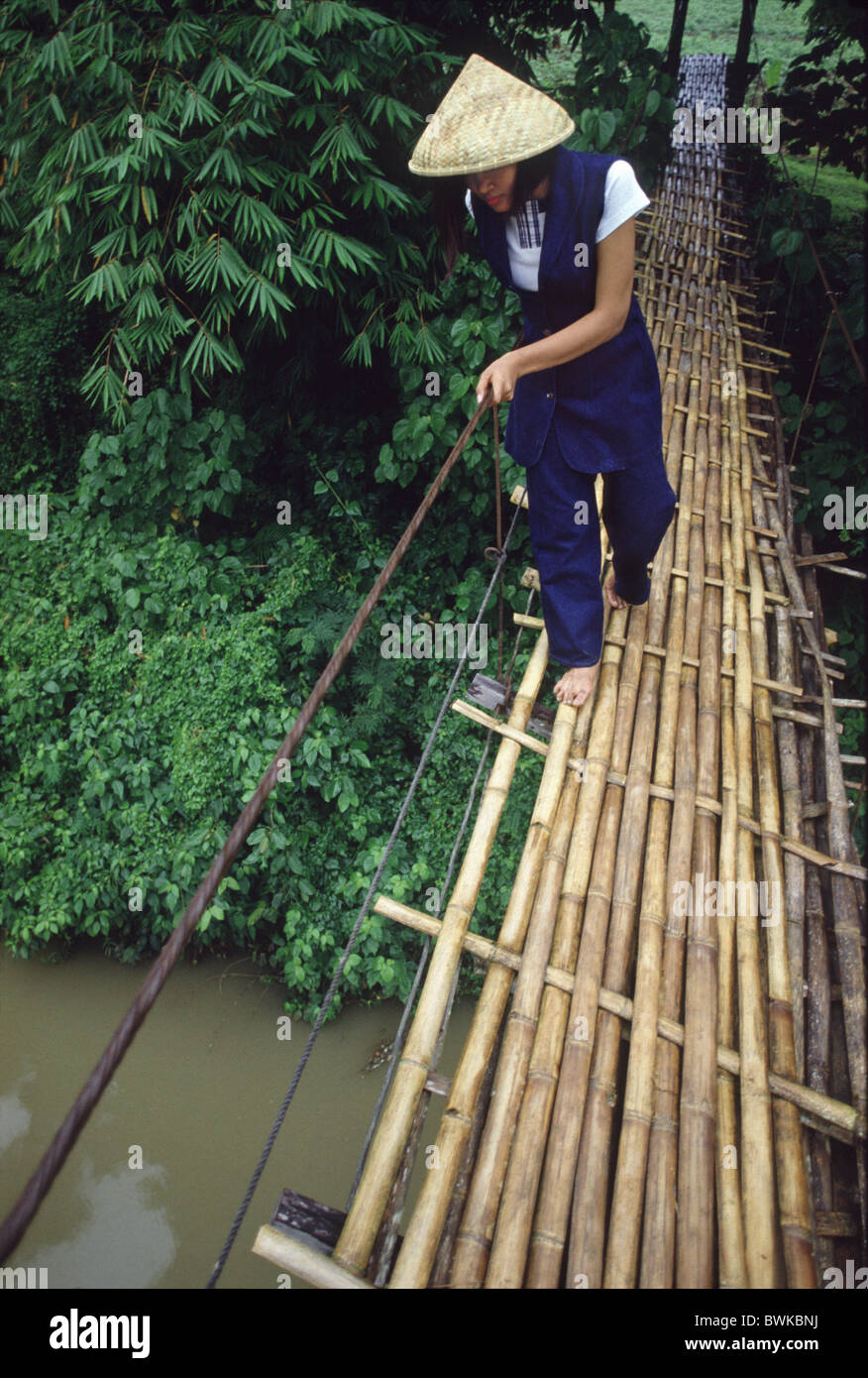 Woman crossing hanging bridge over Loboc River, Loboc, Bohol Island ...