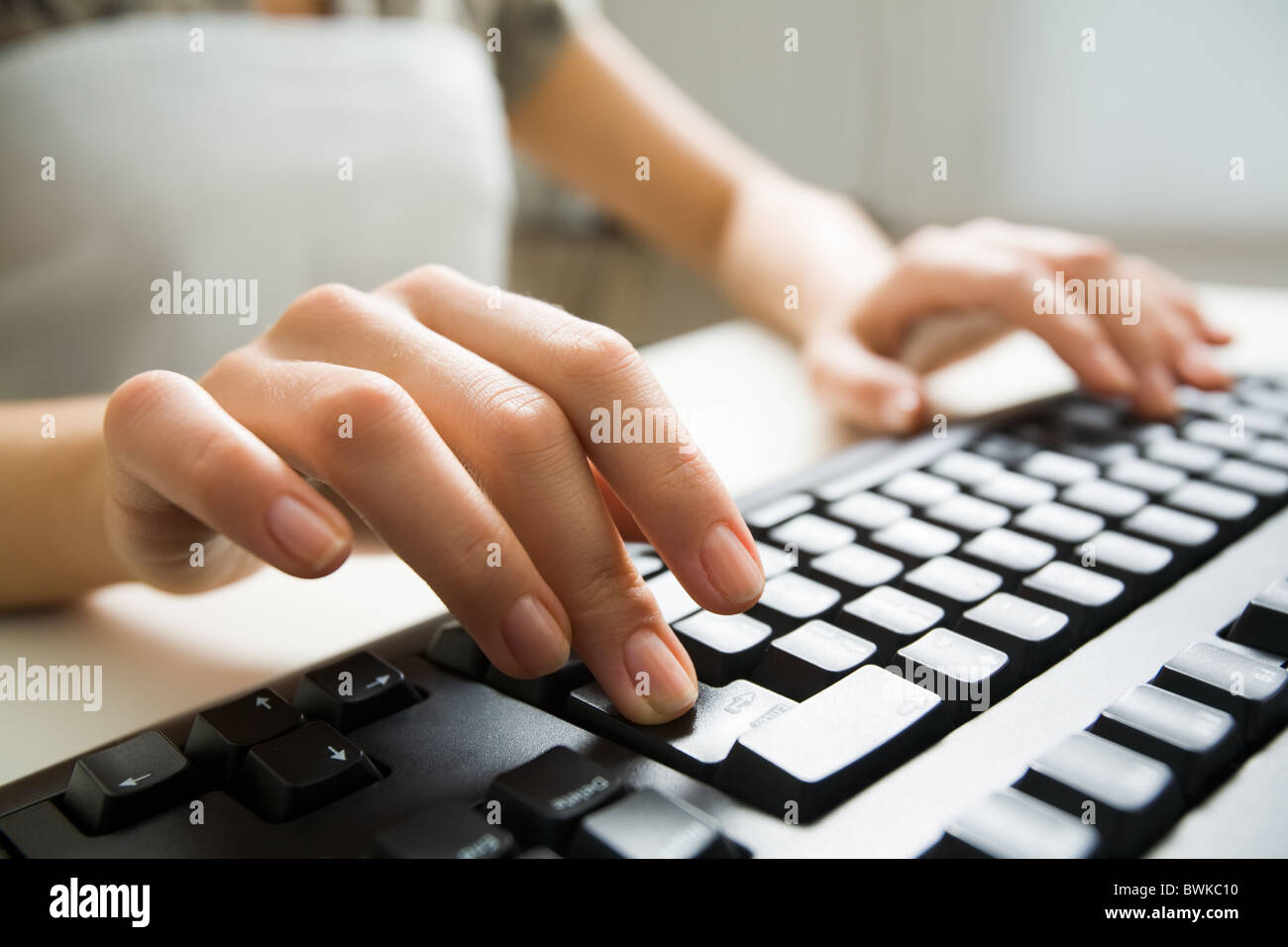 Close-up of female fingers pushing enter key to start the system Stock ...