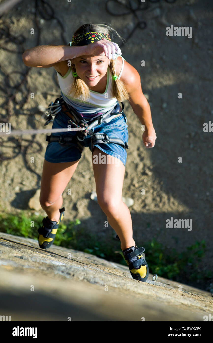 Image of woman hanging on the rope and looking at camera Stock Photo ...
