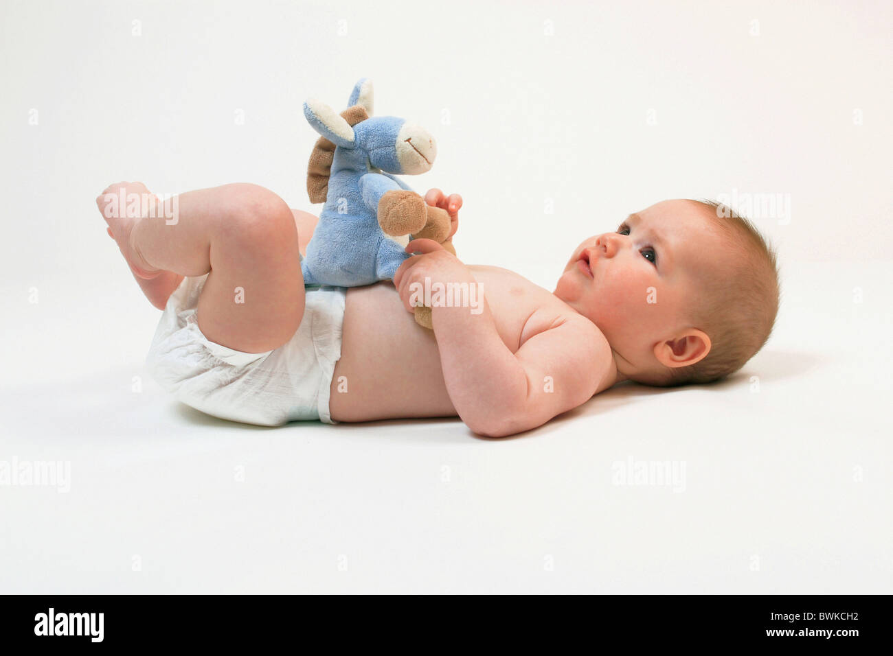 baby infant child diapers nappies recumbent lie lying soft toy soft toy ...